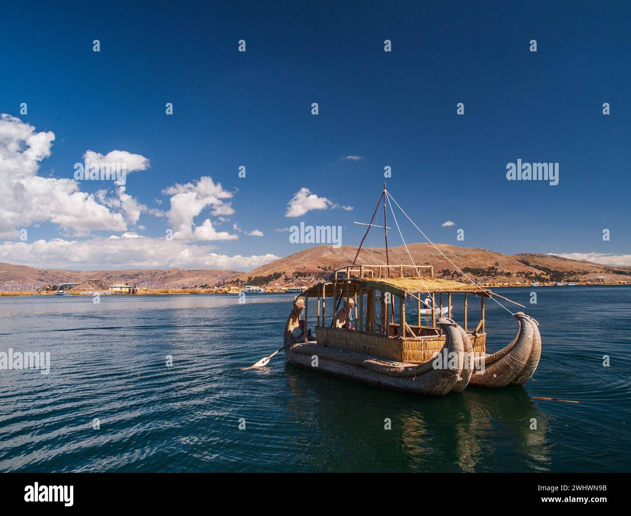 Large handmade totora reed boat sailing in the Uros Islands in Lake ...