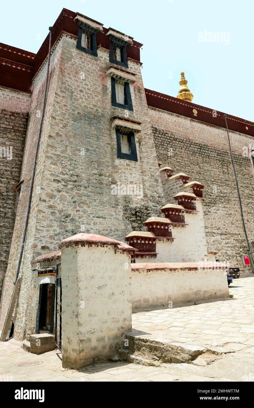 A staircase rises along the stone walls on the exterior of the Sera Monastery, located just ...