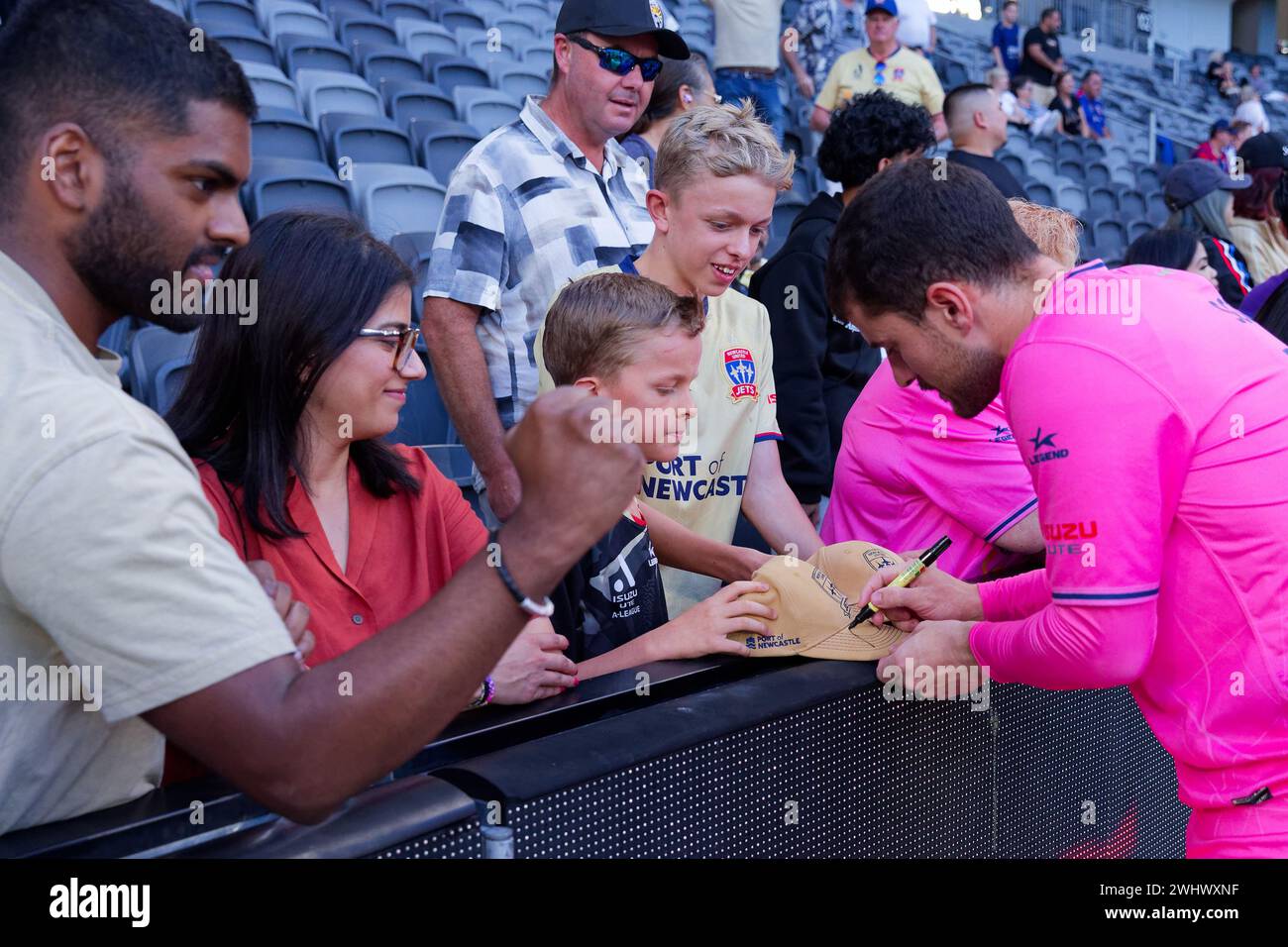Sydney, Australia. 11th Feb, 2024. Ryan Scott of Newcastle Jets signs ...