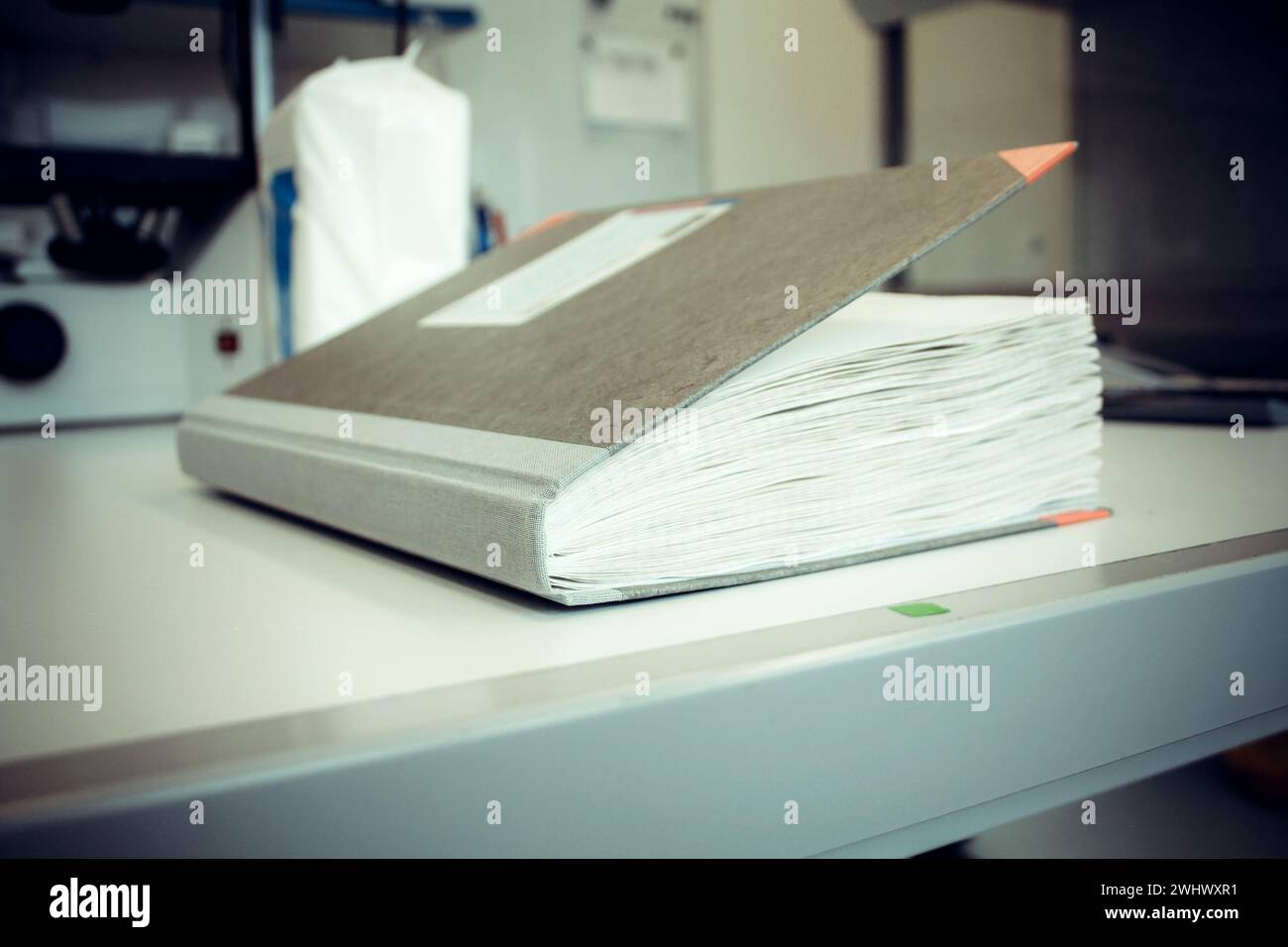 Thick laboratory journal at work Stock Photo - Alamy