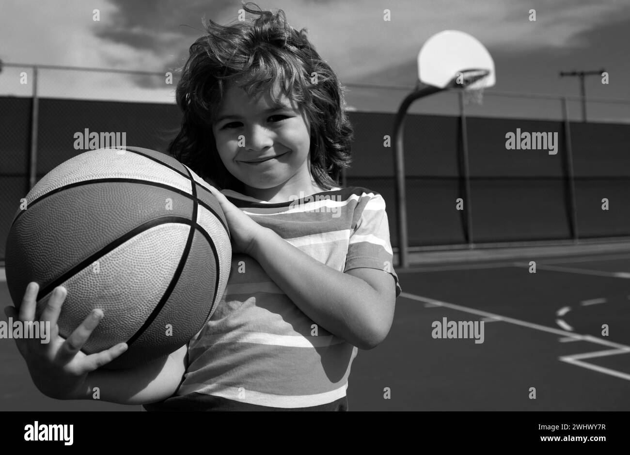 Little child boy playing basketball with basket ball. Active kids ...