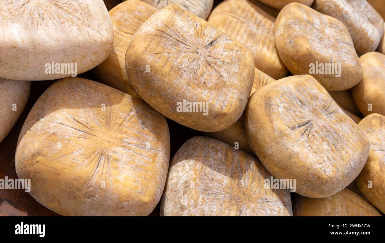 Artisanal Cheese Wheels Stacked at a Rustic Market Stall Stock Photo ...