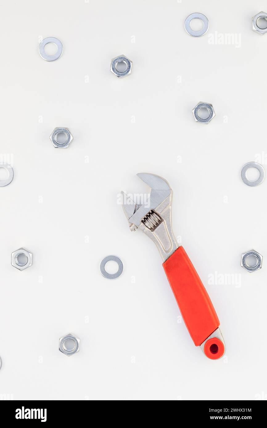 Flat lay of metal nuts and spanner Stock Photo - Alamy