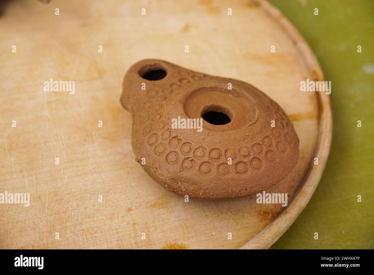 Roman oil lamp made from fresh clay Stock Photo - Alamy