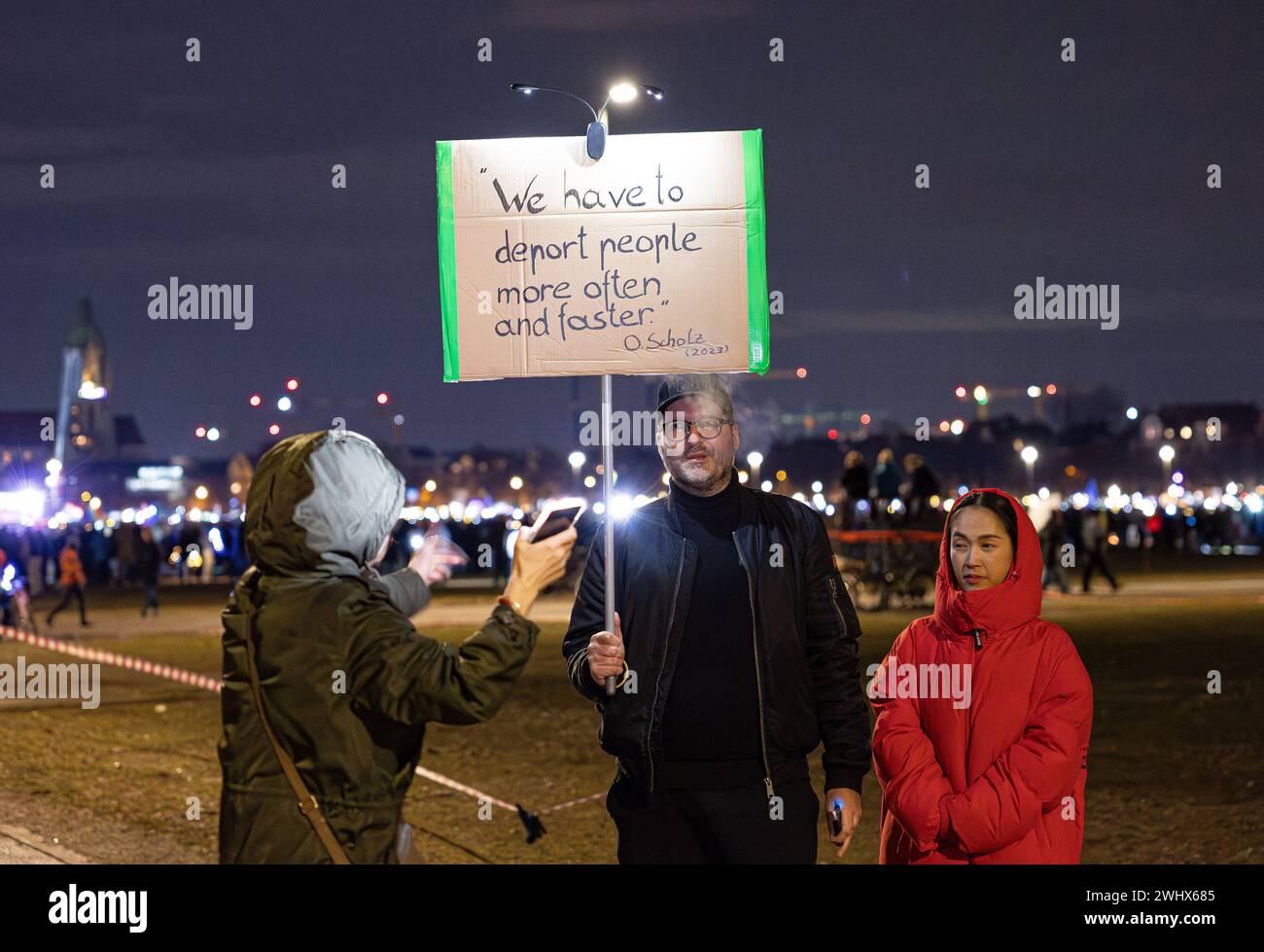 Protestor quotes chancelor Olaf Scholz ( SPD ): " We have to deport ...