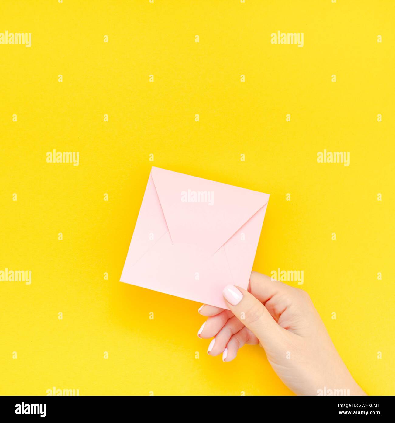 Holding up envelope hi-res stock photography and images - Alamy