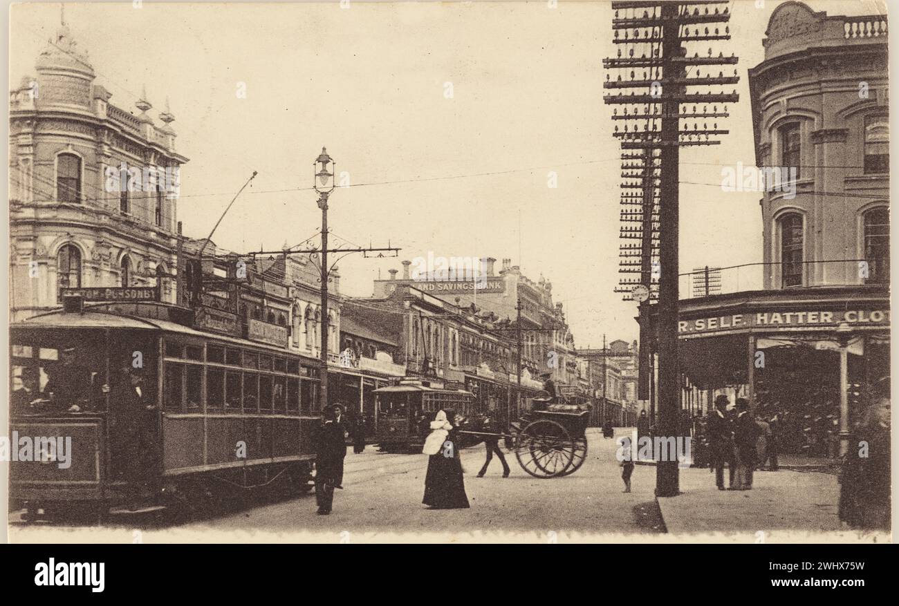 Queen Street in Auckland, with tams passing by commercial street. Vintage street photographic ...