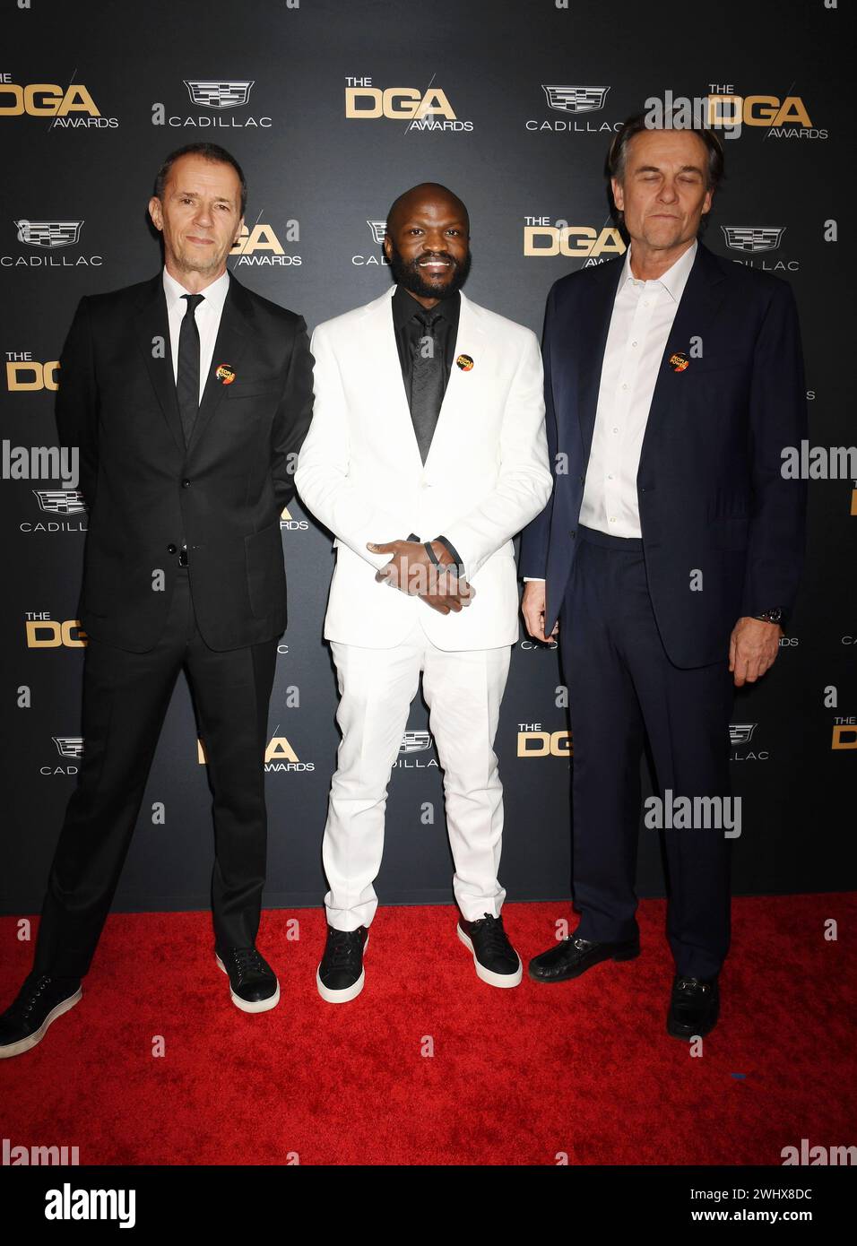 BEVERLY HILLS, CALIFORNIA - FEBRUARY 10: (L-R) John Battsek, Moses Bwayo and Christopher Sharp ...