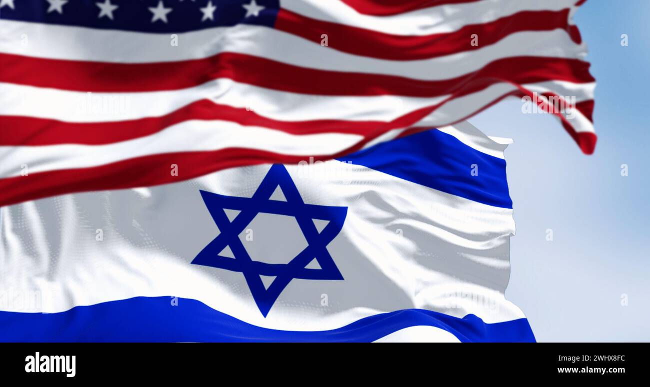 State of Israel national flag waving in the wind with the American flag ...