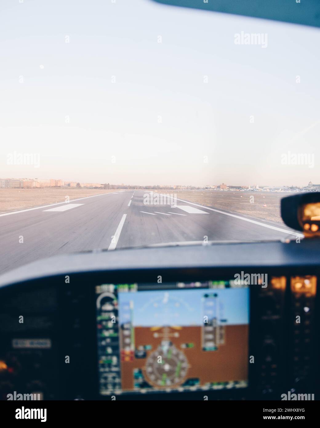 Cockpit of a small plane landing on the airport runway at sunset Stock ...