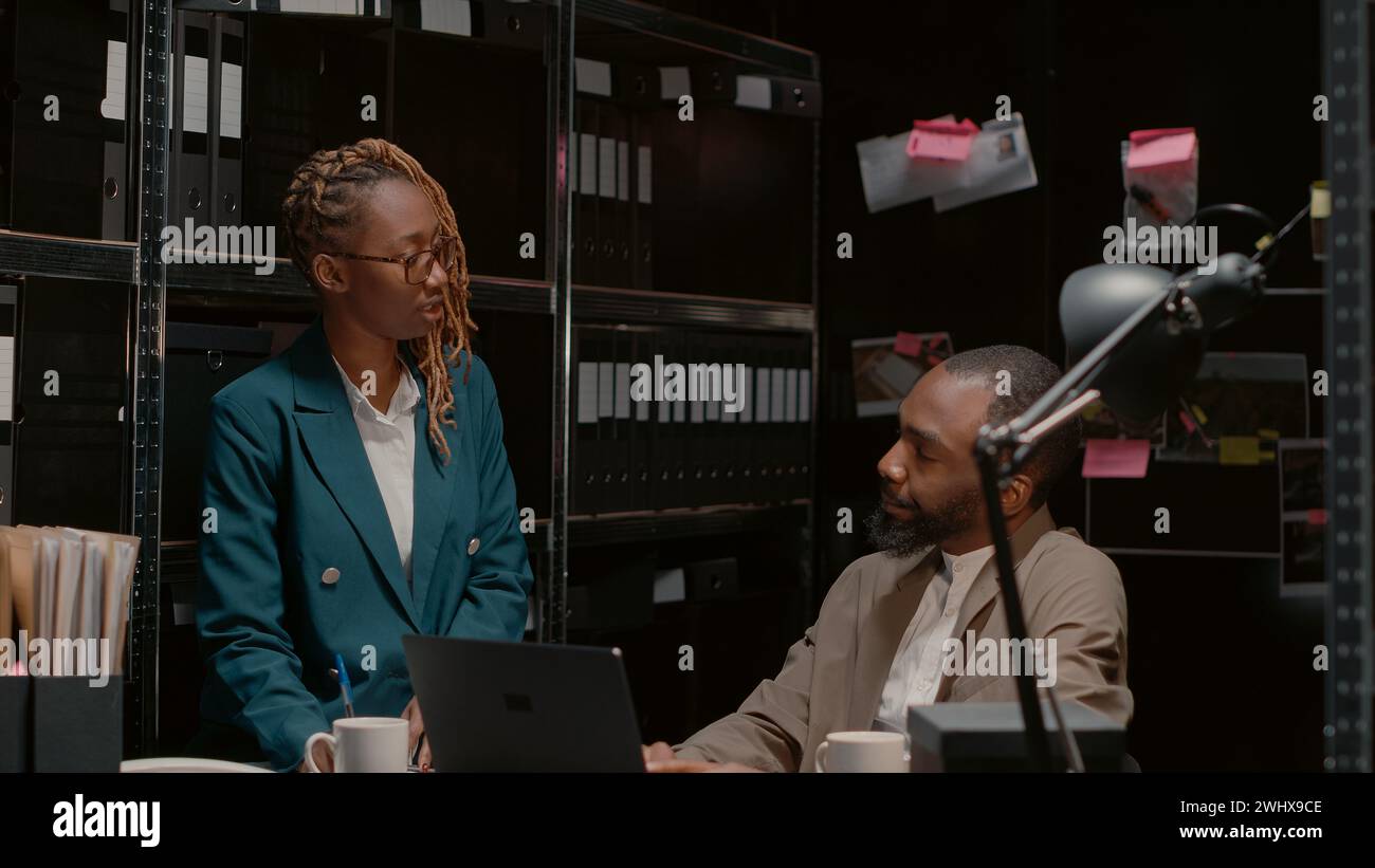 Police officer reading criminal records hi-res stock photography and ...