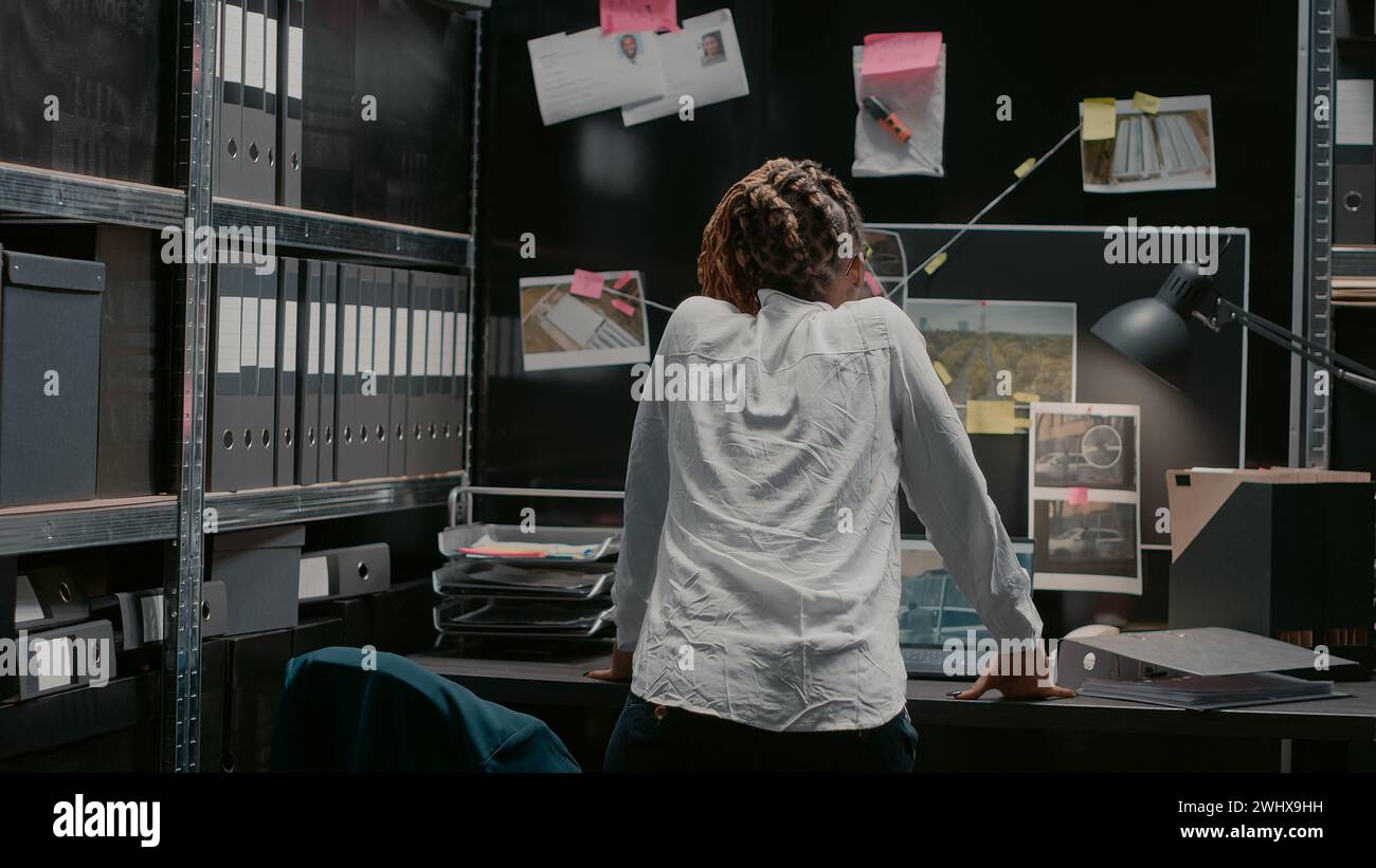 Law officer examining physical evidence hi-res stock photography and ...