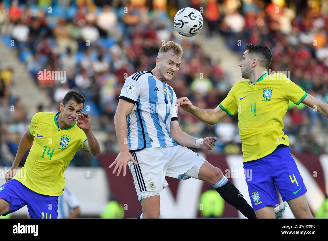 Argentina's Luciano Gondou, center, scores the opening goal against Brazil during South America ...