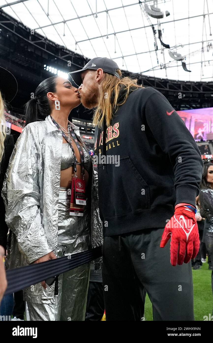 San Francisco 49ers tight end George Kittle, right, kisses his wife ...