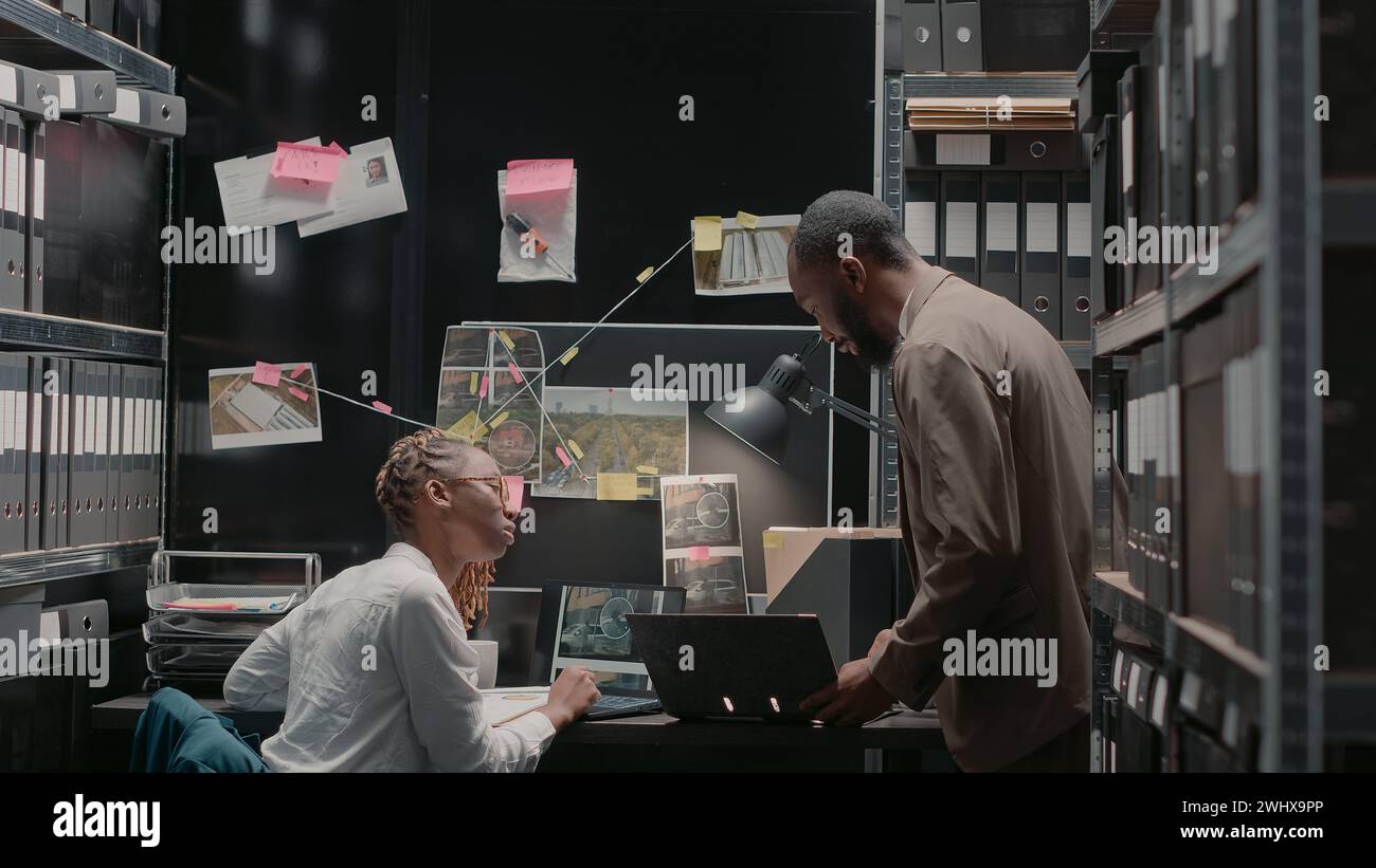 Private detectives checking crime scene photos on map, working to find ...