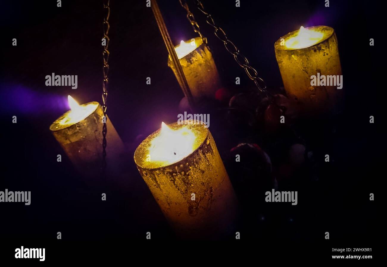 Magic candle light on chains Stock Photo - Alamy