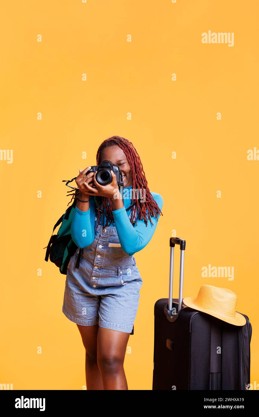 Traveller taking pictures with camera of buildings architecture and ...