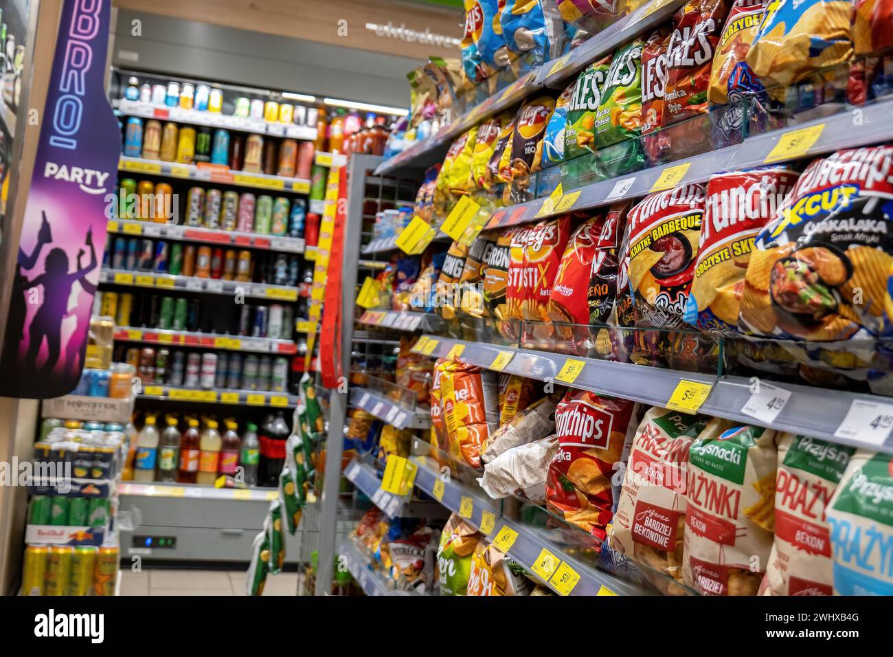 Convenience store alley with chips crisps party snacks and energy ...