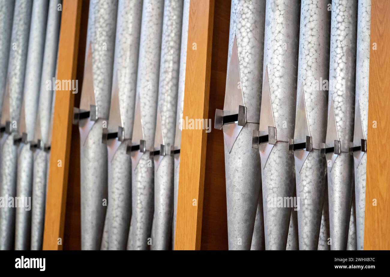 Pipe organ metal pipes in a row closeup detail, nobody. Religious music ...