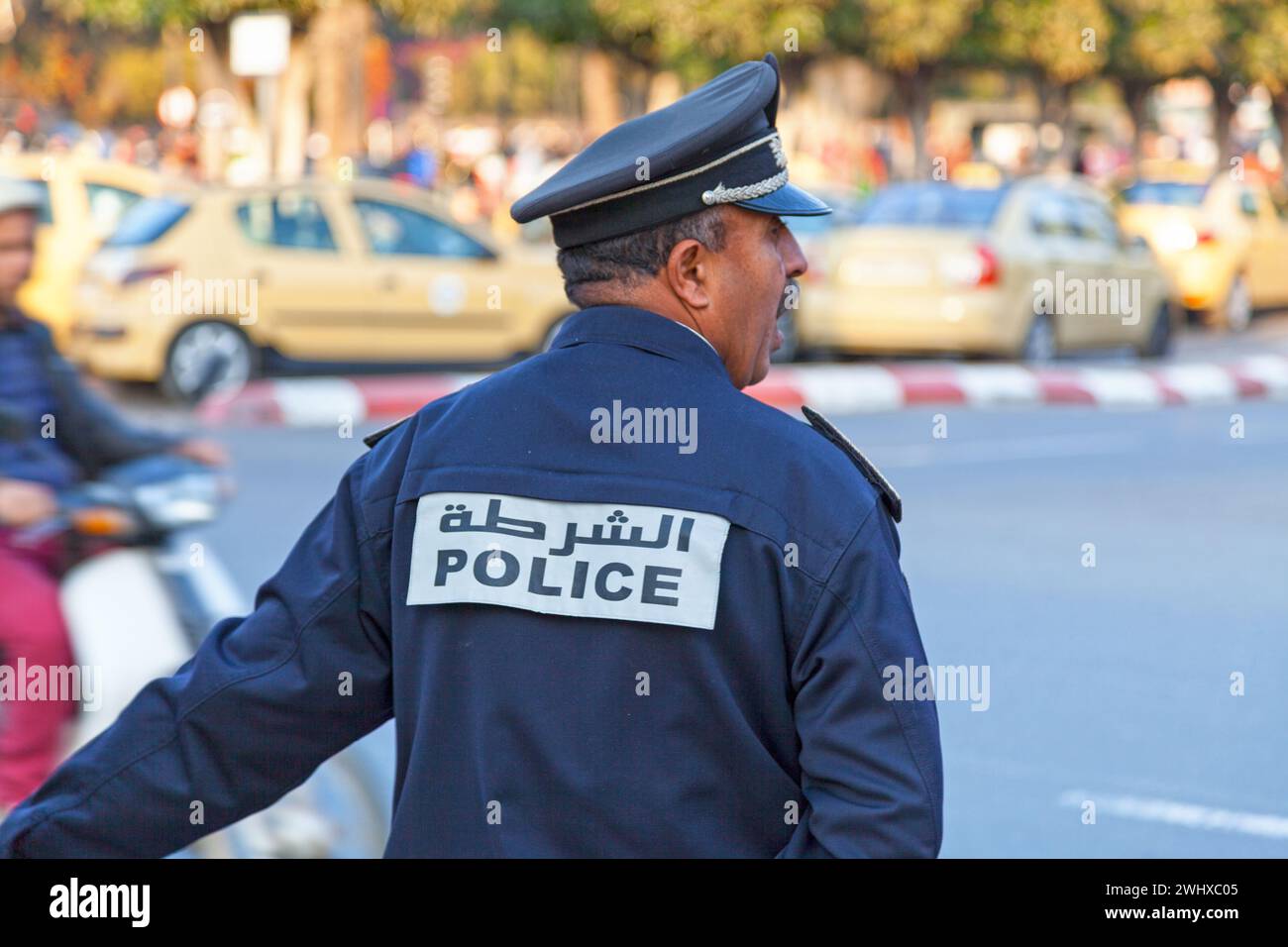 Marrakesh, Morocco - January 15 2018: Policeman regulating traffic at a ...