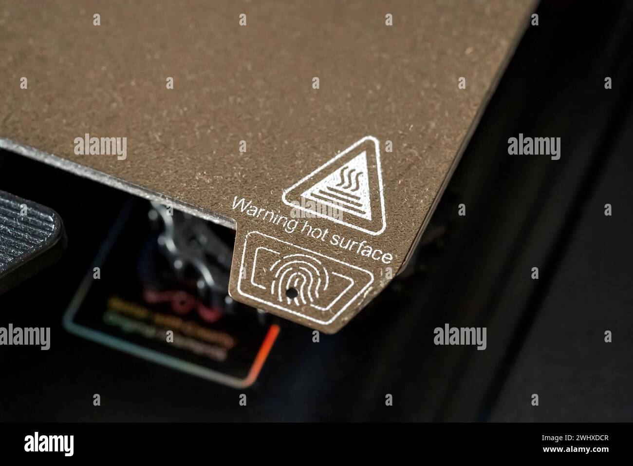 A 3D printer heated bed building pad hot surface warning label seen ...