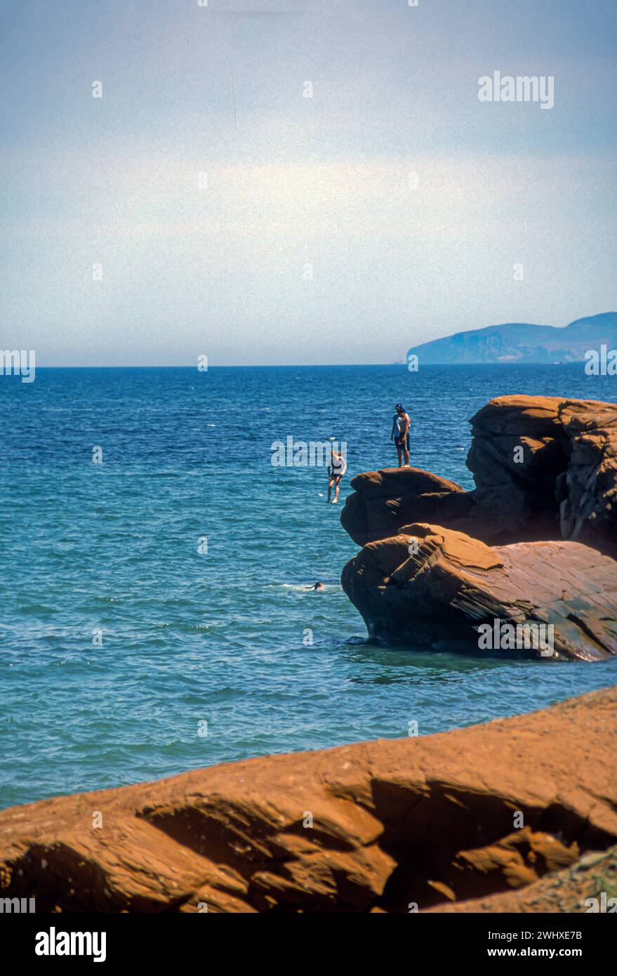 kayaking and exploring the red sandstone cliffs of the Isles de ...