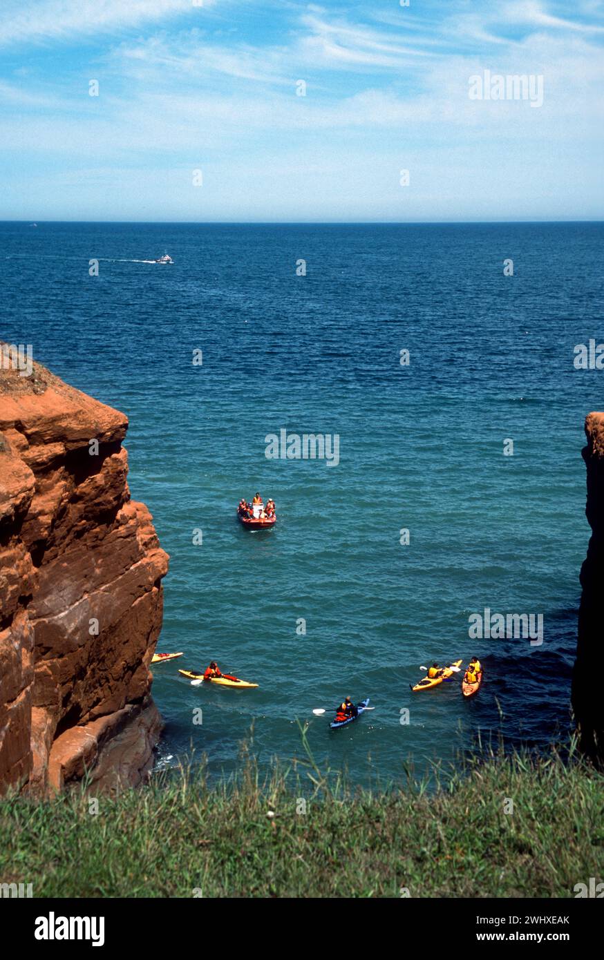 kayaking and exploring the red sandstone cliffs of the Isles de ...