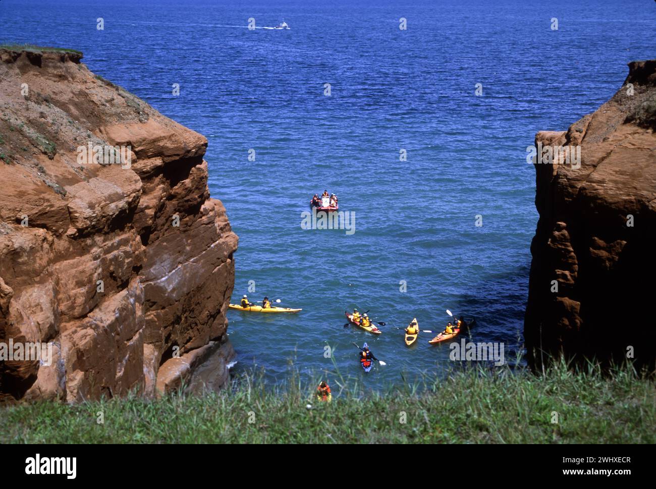 kayaking and exploring the red sandstone cliffs of the Isles de ...