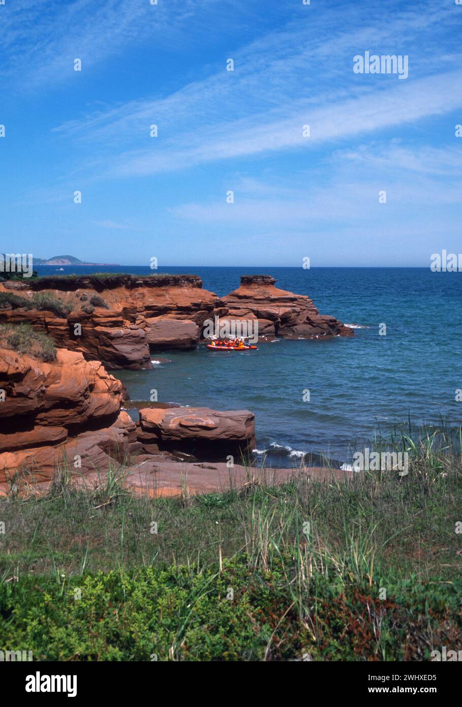 kayaking and exploring the red sandstone cliffs of the Isles de ...