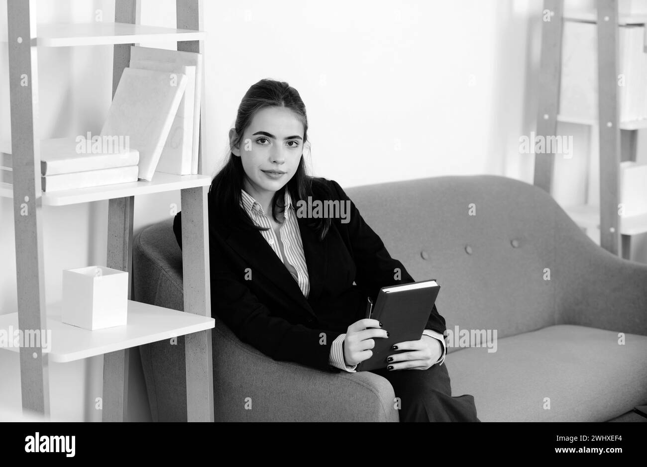 Young businesslady at workplace in the office. Beautiful secretary ...