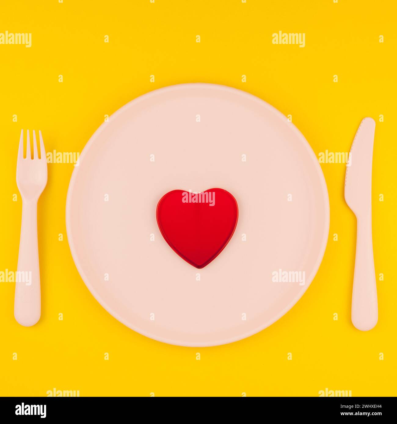 Red heart on serving table. Romantic concept Stock Photo - Alamy
