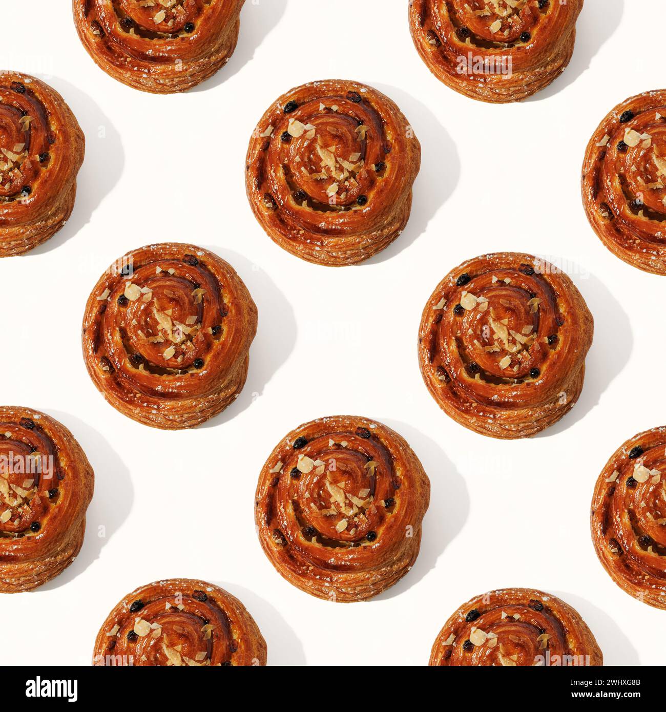 pattern with cinnamon buns on white background. Top view Stock Photo ...
