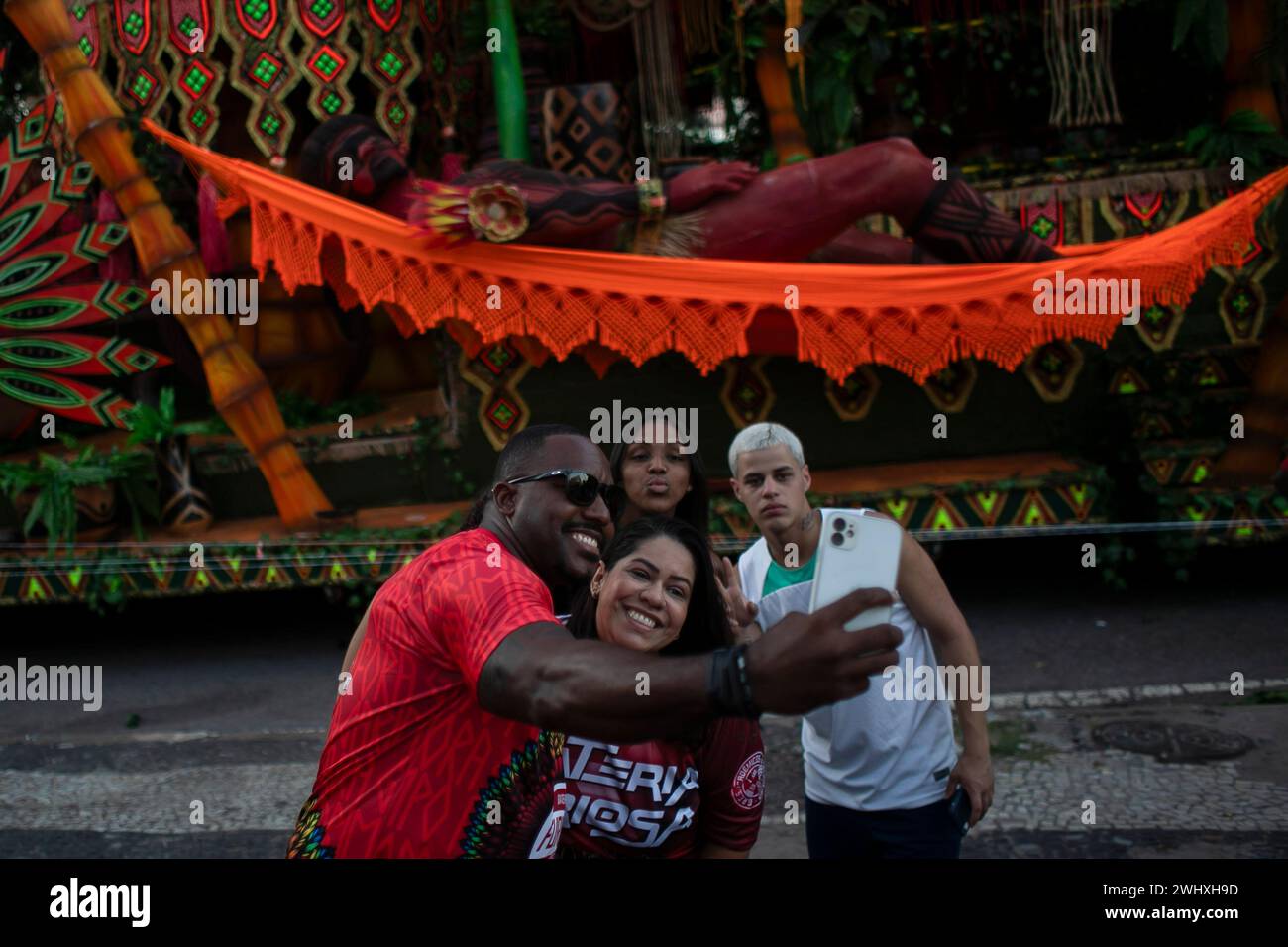 People Take Selfies In Front Of A Float Before The Samba School Parade
