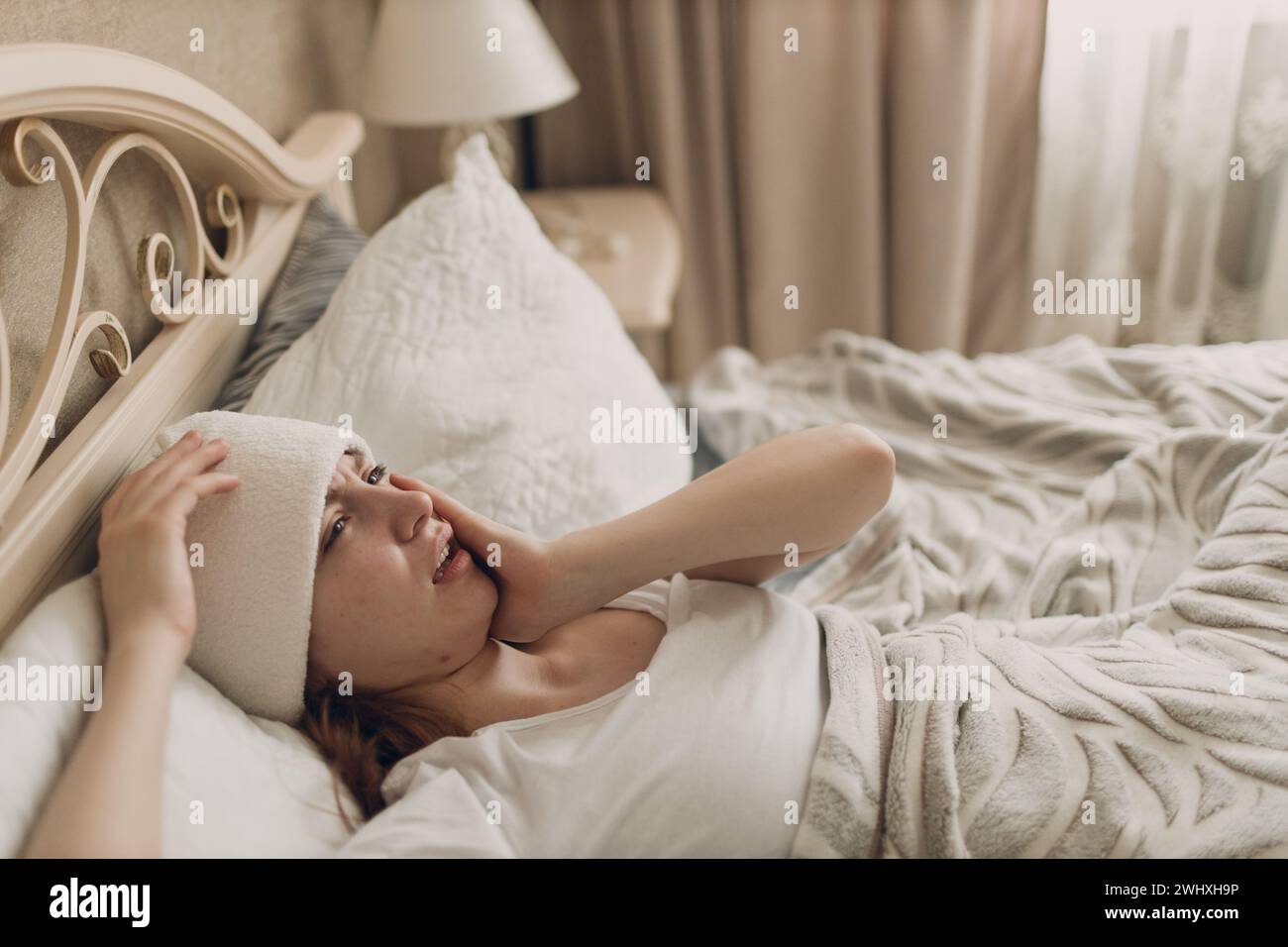 Young woman with headache flu ill sick disease cold at home indoor ...