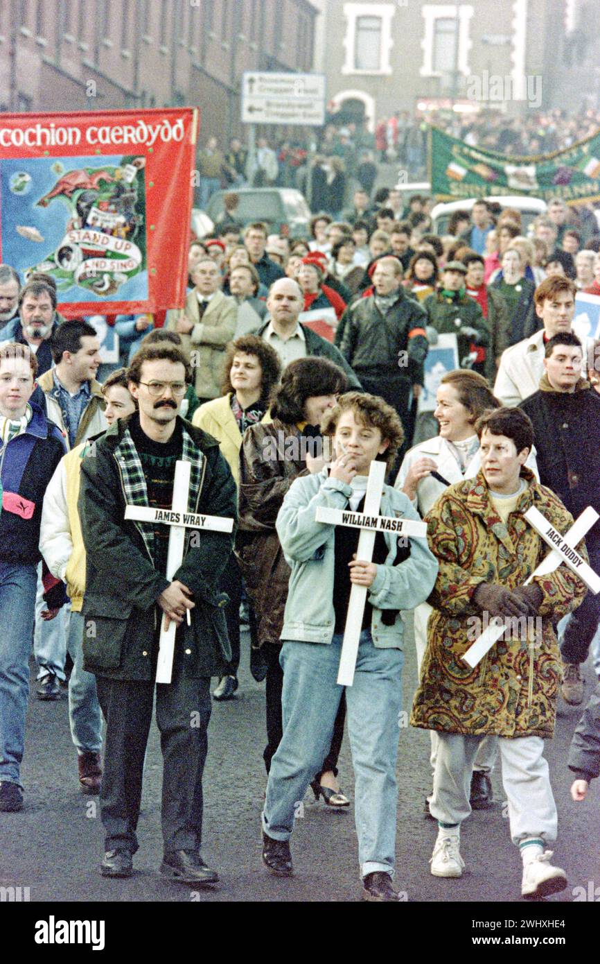 Relatives carry crosses bearing the names of marchers killed by British ...