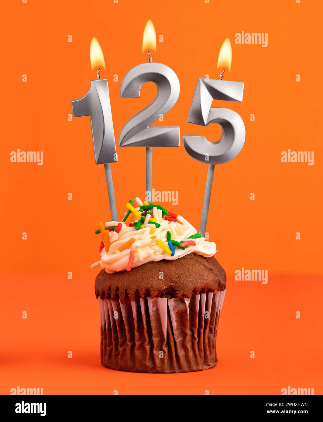 Number 125 candle - Birthday cupcake on orange background Stock Photo ...