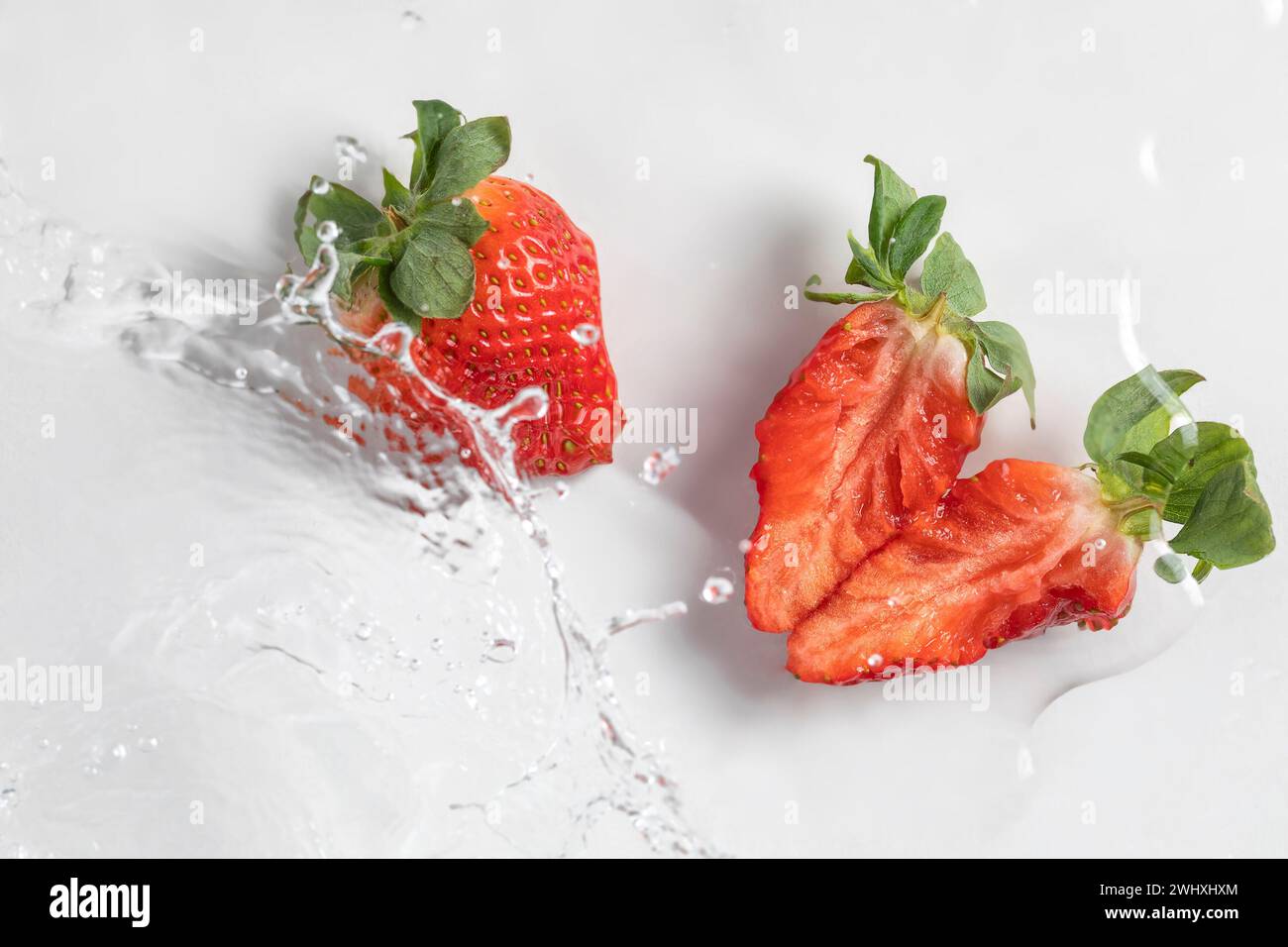Juicy fresh strawberry in water splash Stock Photo - Alamy