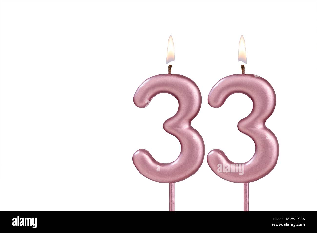 Candle number 33 - Lit birthday candle on white background Stock Photo ...