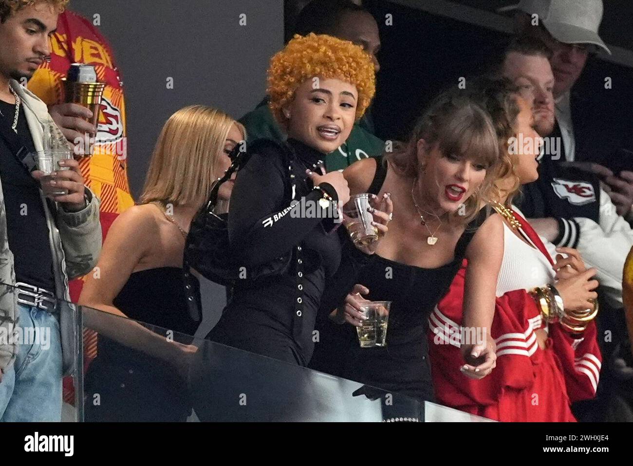 Ice Spice, left, and Taylor Swift talk before the NFL Super Bowl 58 ...