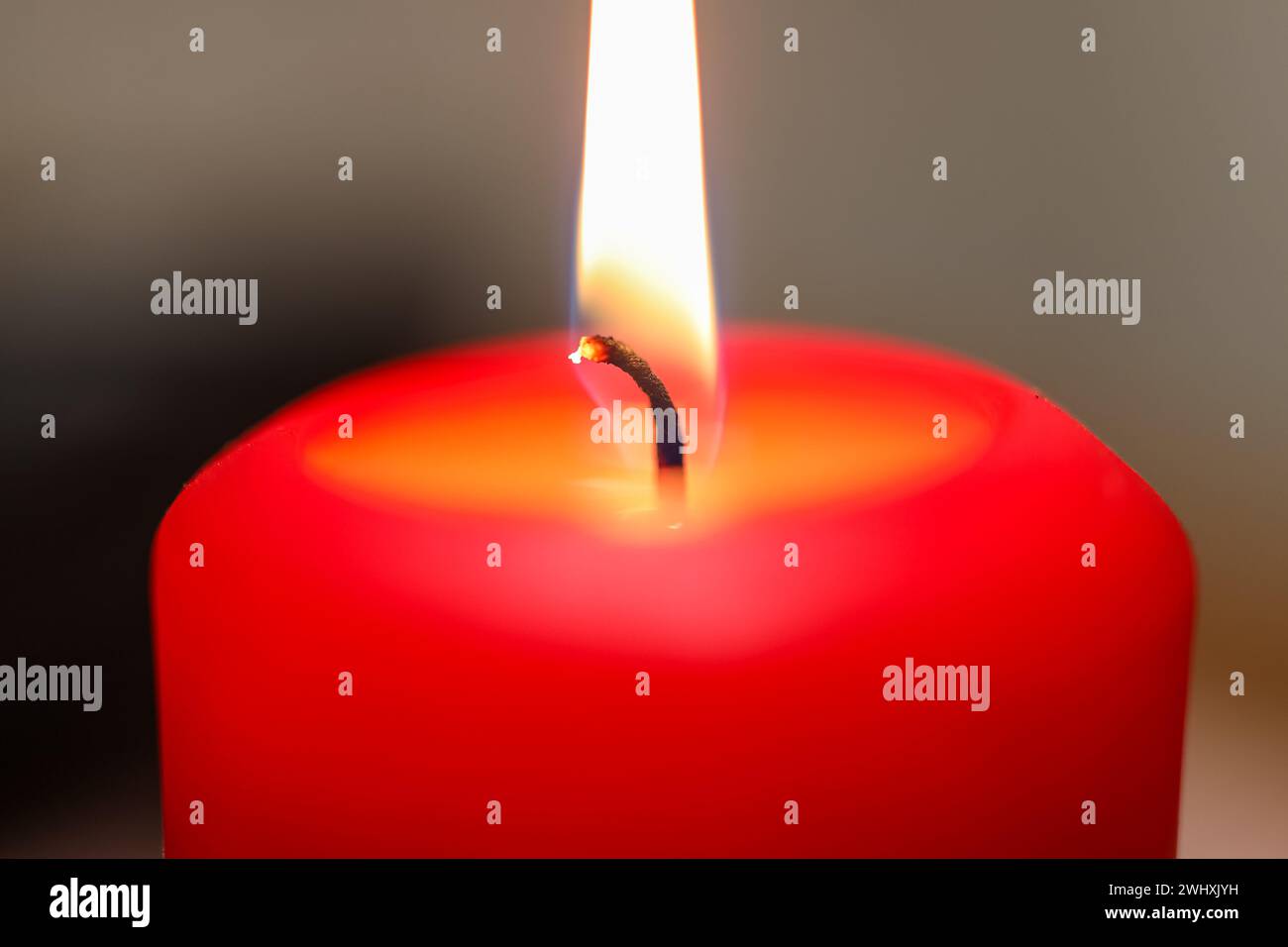 Burning candle wick red candle Stock Photo - Alamy