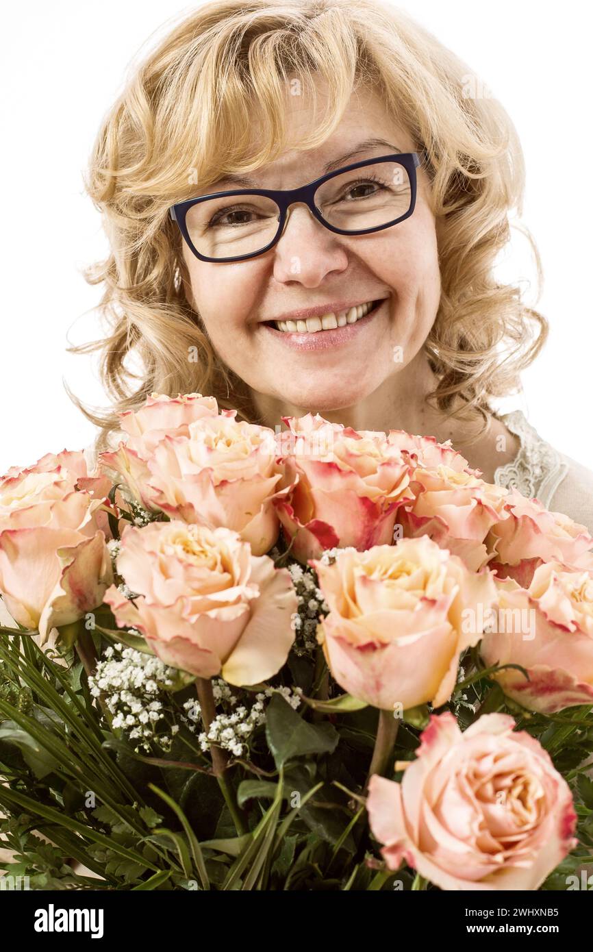 Older woman roses hi-res stock photography and images - Alamy