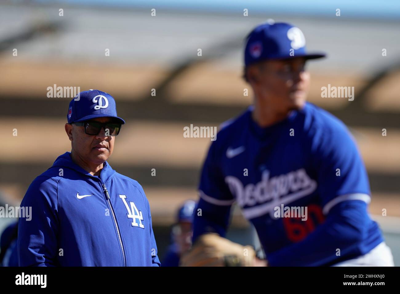 Los Angeles Dodgers manager Dave Roberts, left, looks on as Eduardo ...