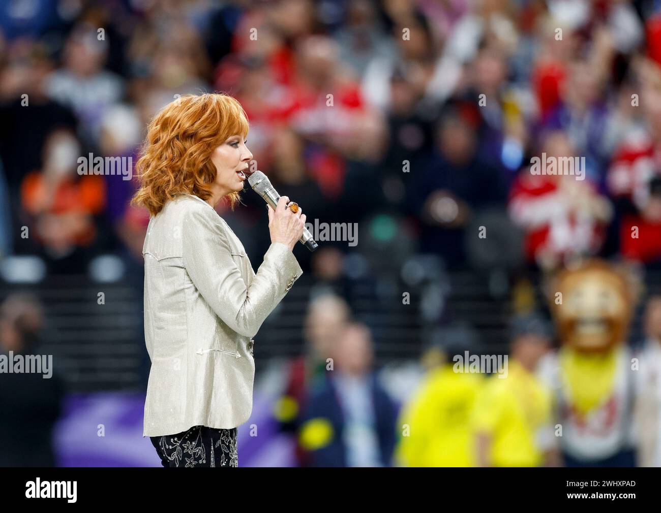 Country music icon and Grammy Award winner Reba McEntire sings the national anthem during the ...