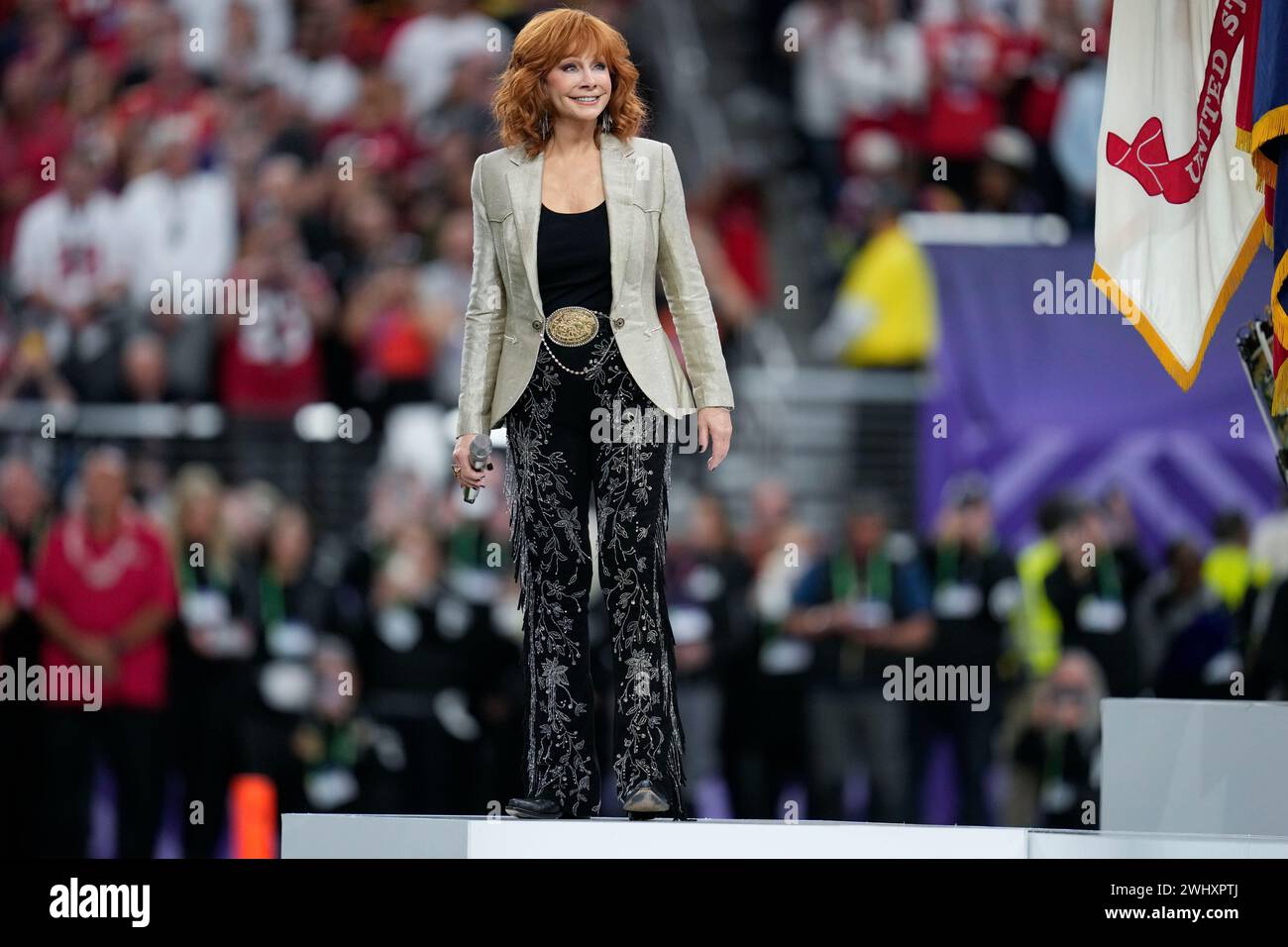 Reba McEntire performs the national anthem before the NFL Super Bowl 58 ...