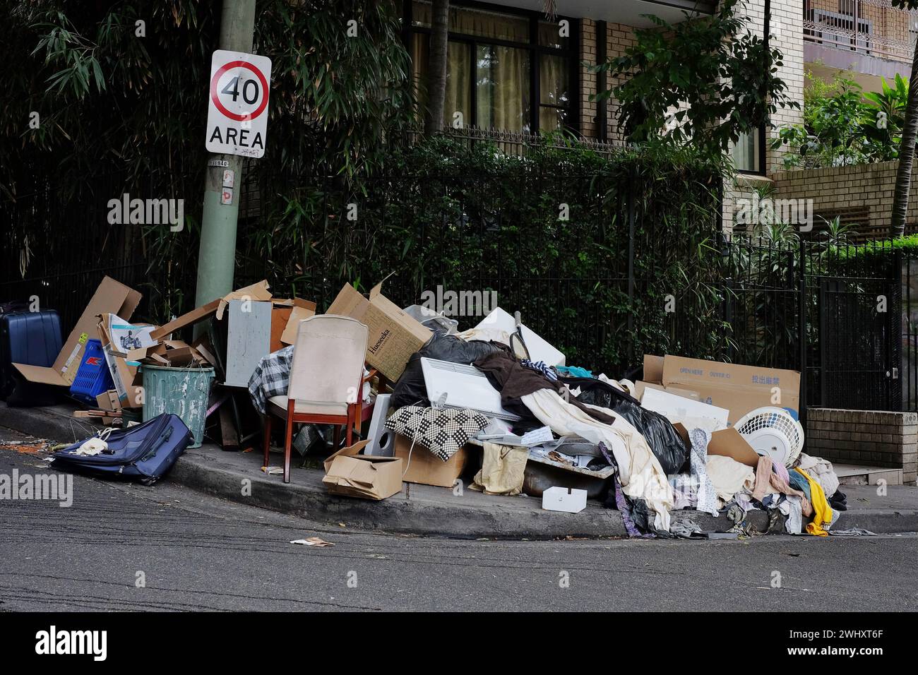 Outside inner city apartments, furniture, chairs, clothing, bedding ...
