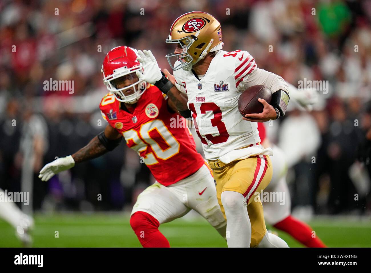 San Francisco 49ers quarterback Brock Purdy (13) tries to elude Kansas ...
