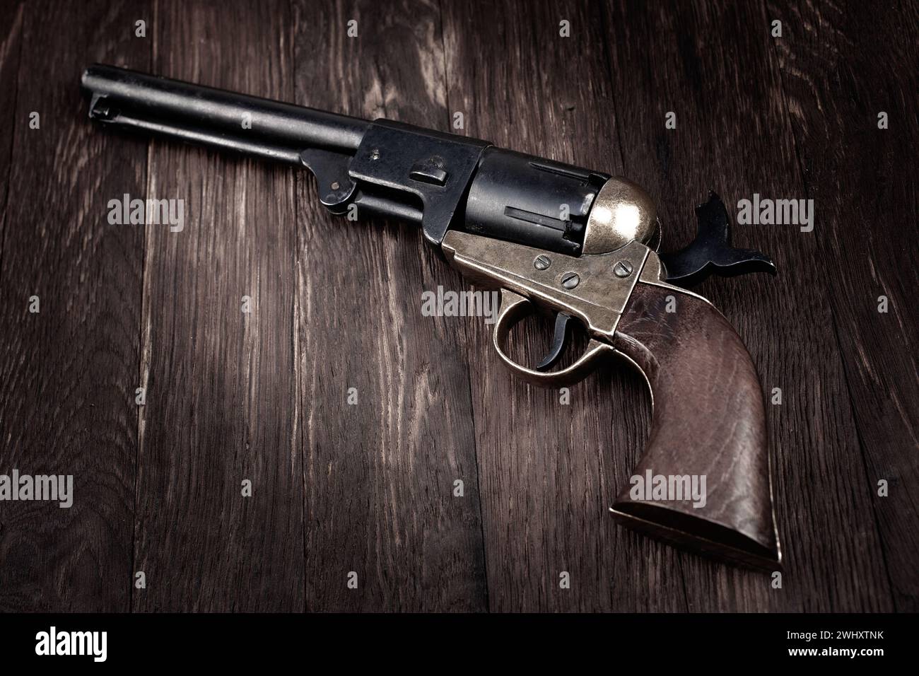 Old West gun. Percussion Army Revolver on wooden table Stock Photo - Alamy