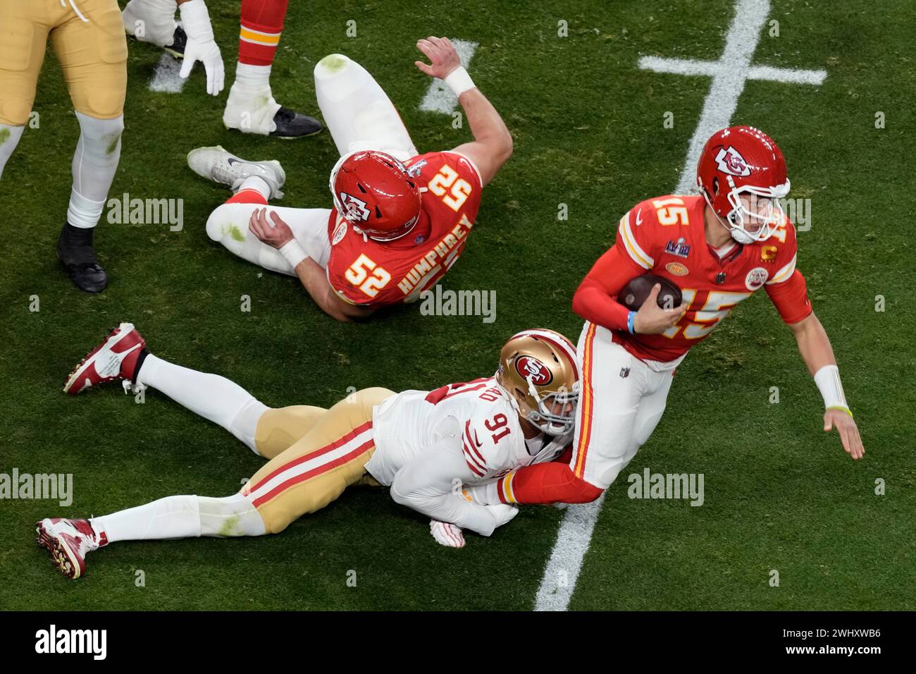 Kansas City Chiefs quarterback Patrick Mahomes (15) is tackled by San ...