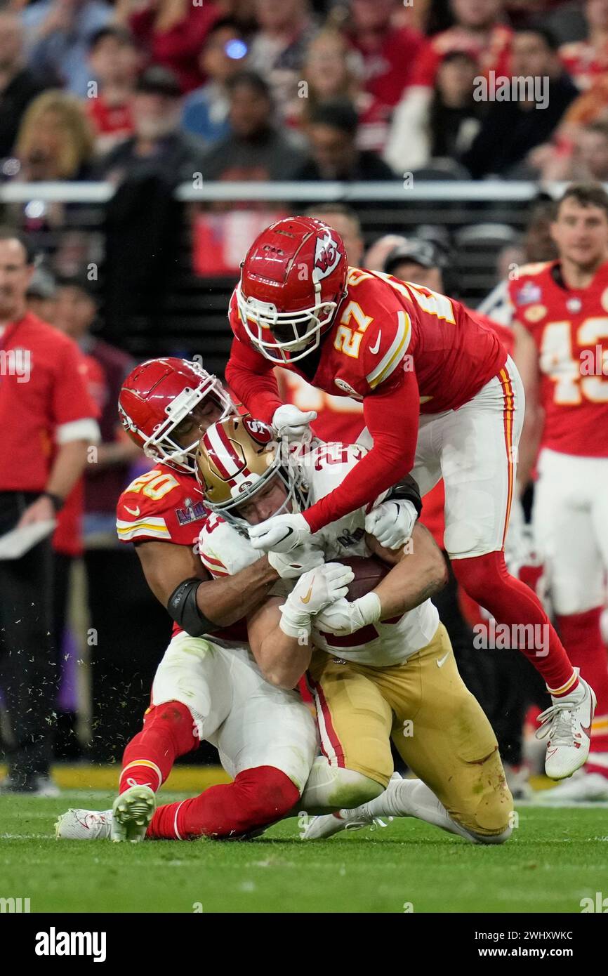 San Francisco 49ers running back Christian McCaffrey (23) is hit by ...