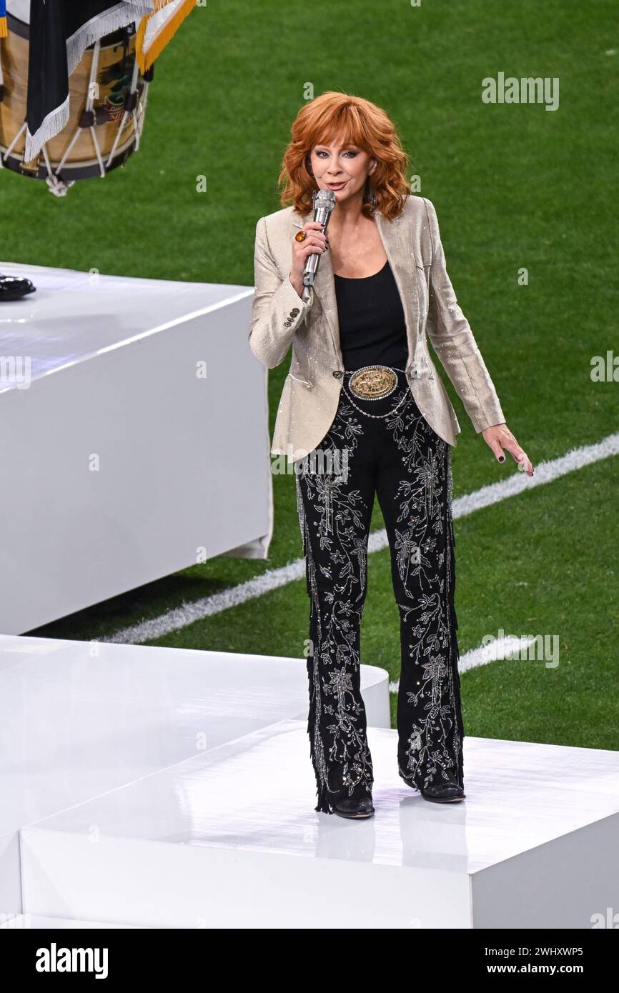 Las Vegas, USA. 11th Feb, 2024. Reba McEntire sings The National Anthem during the pre-game ...